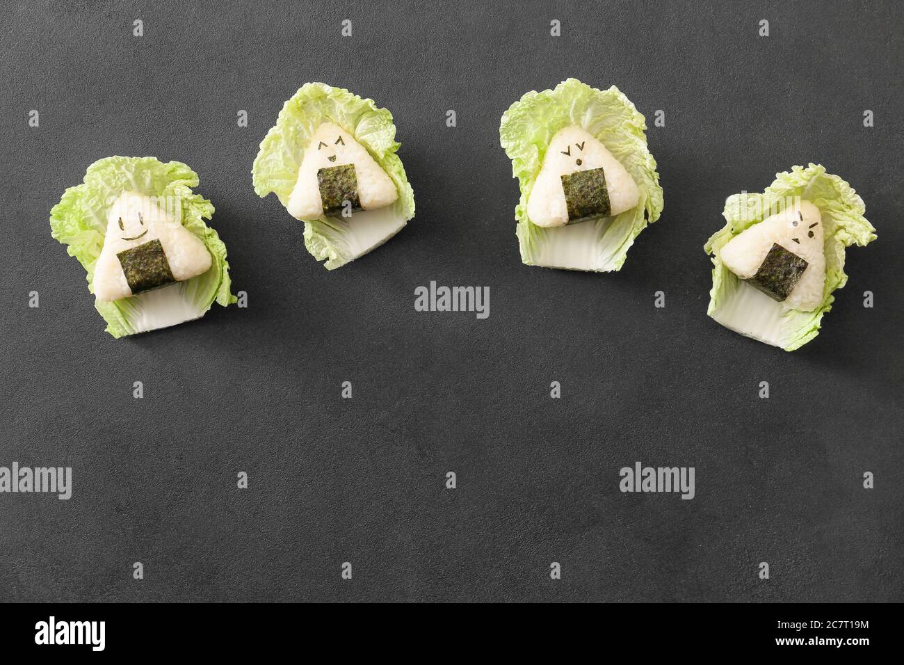 Traditional Japanese onigiri on dark background Stock Photo - Alamy