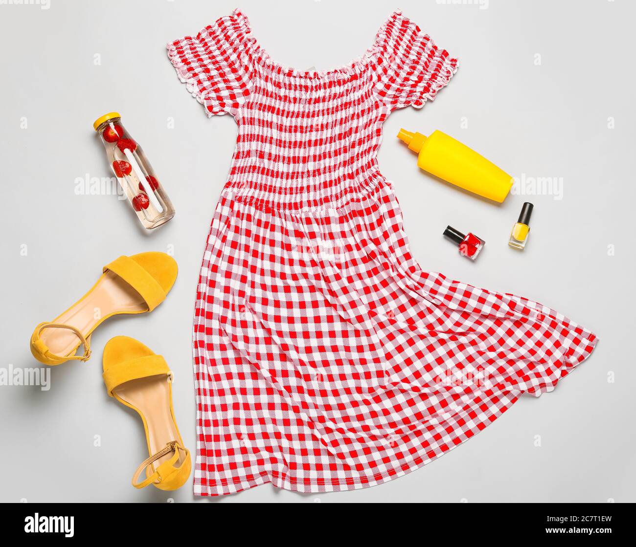 Summer composition with female clothes on light background Stock Photo ...