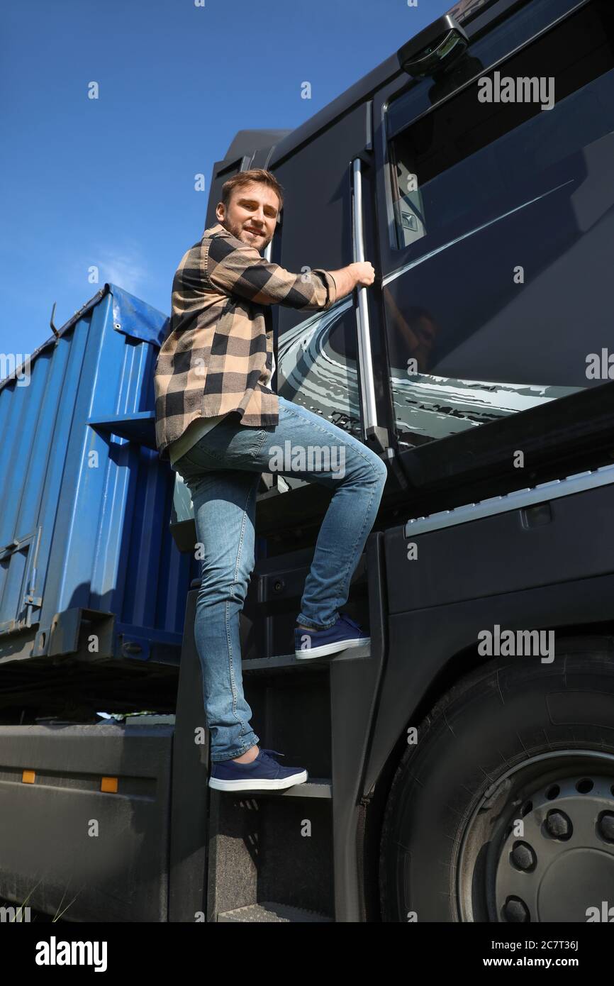 Male driver near big truck outdoors Stock Photo - Alamy