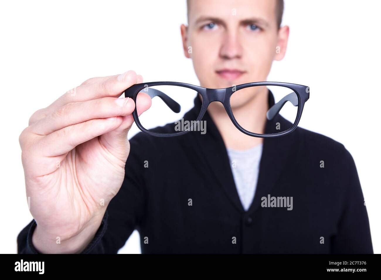 eyeglasses in male hand isolated on white background Stock Photo - Alamy
