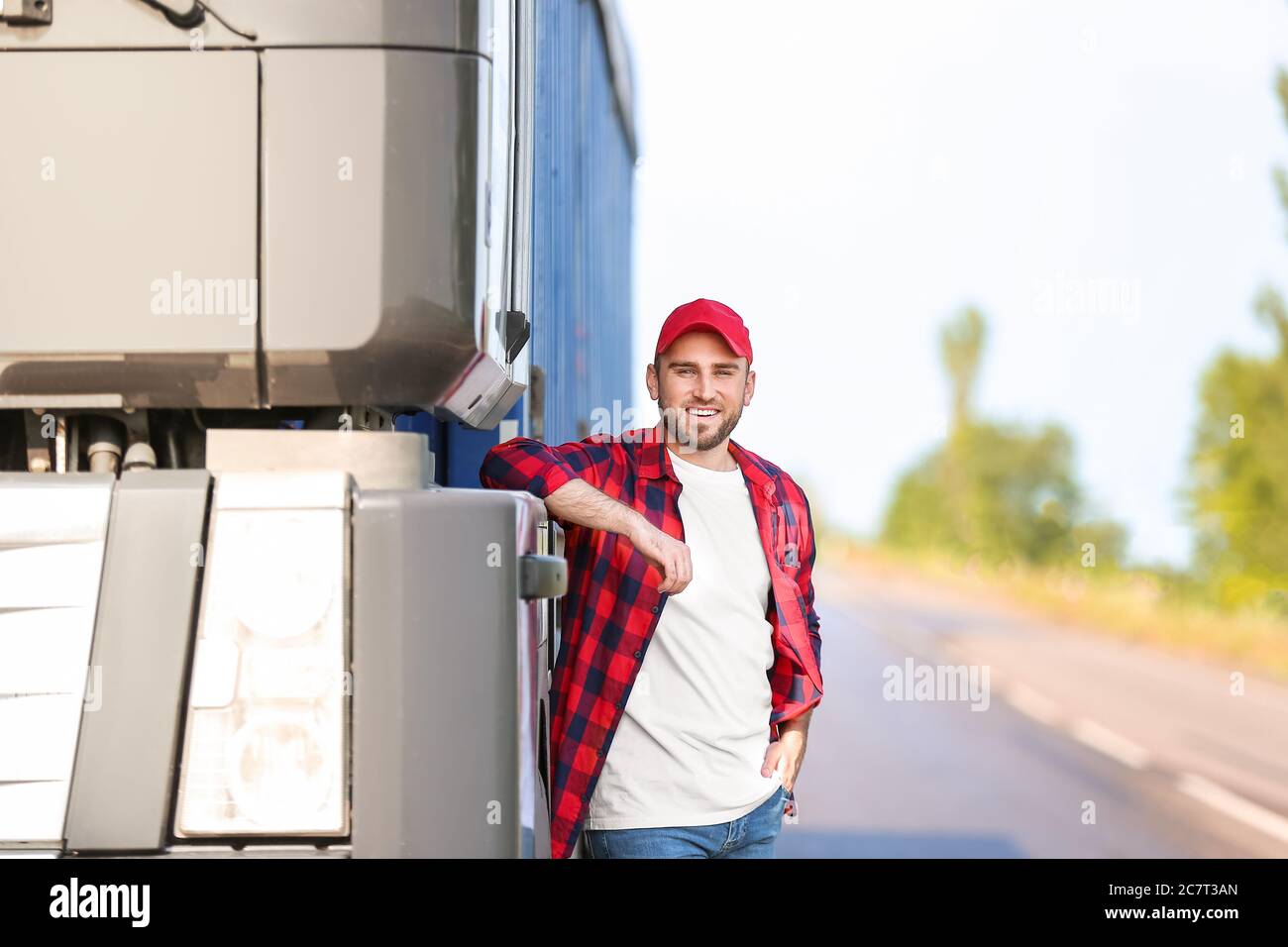Male driver near big truck outdoors Stock Photo - Alamy