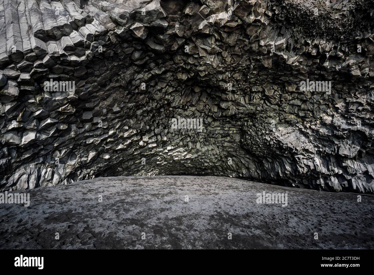 Reynisfjara Beach, Iceland - small cave with stone formations Stock ...