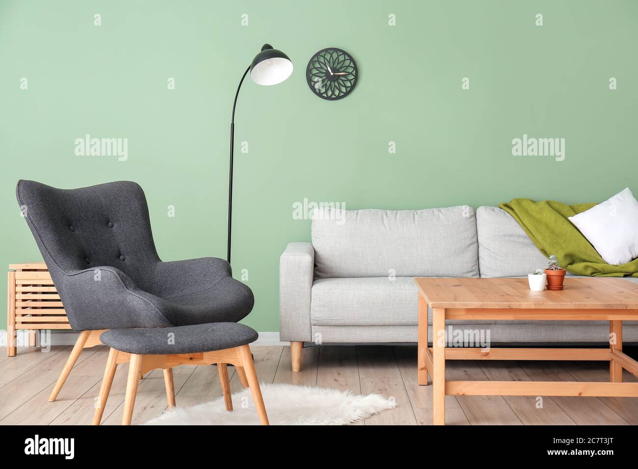Interior of modern living room with armchair Stock Photo - Alamy