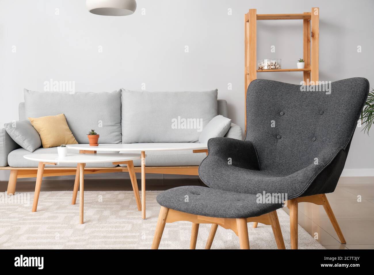 Interior of modern living room with armchair Stock Photo - Alamy