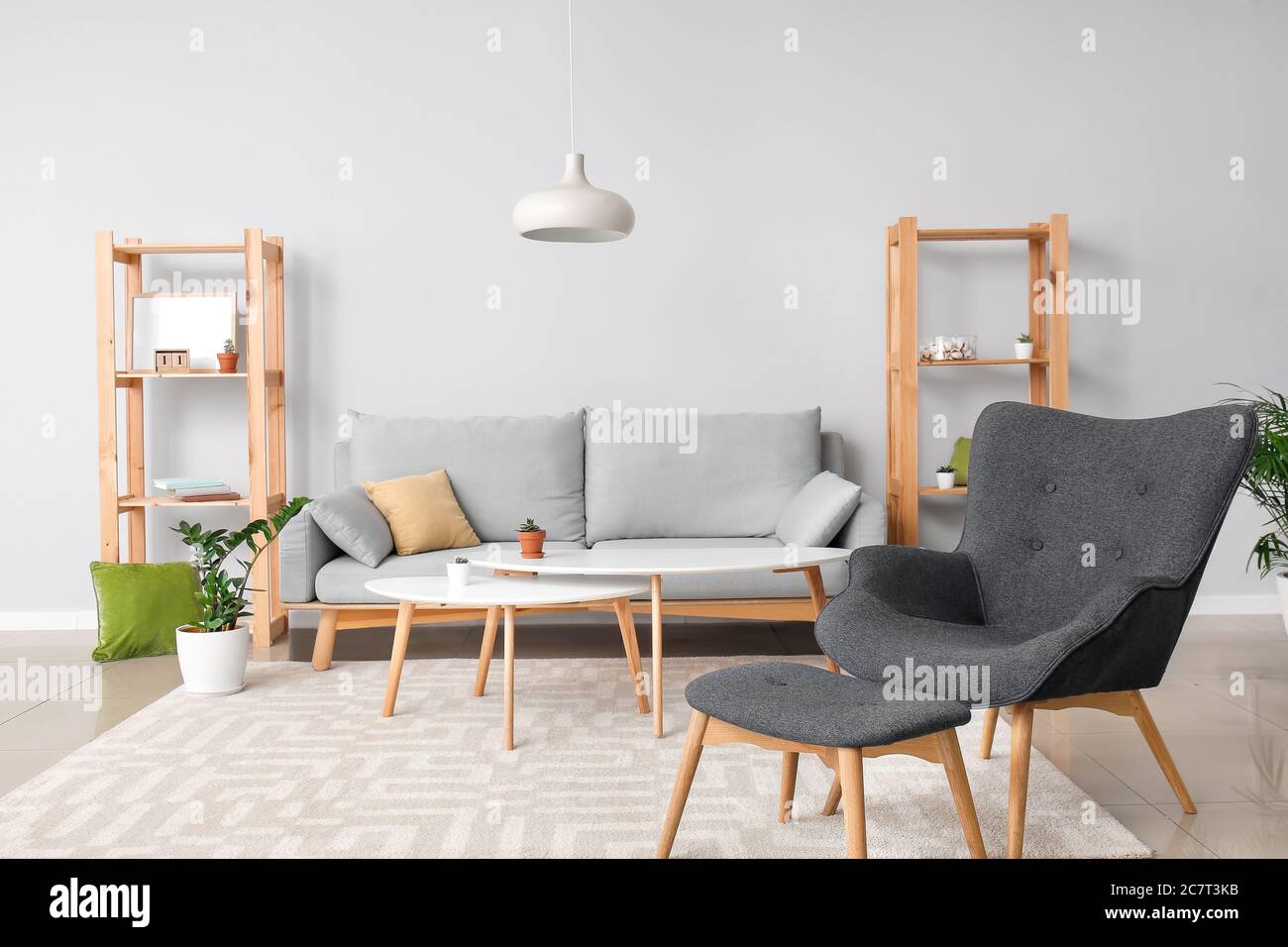 Interior of modern living room with armchair Stock Photo - Alamy