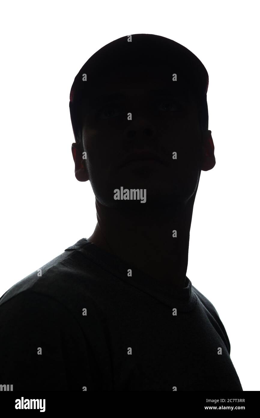 Portrait of a young man in cap, front view - silhouette Stock Photo - Alamy