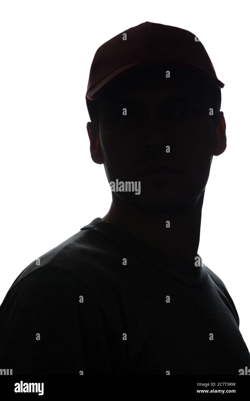 Portrait of a young man in cap, front view - silhouette Stock Photo - Alamy