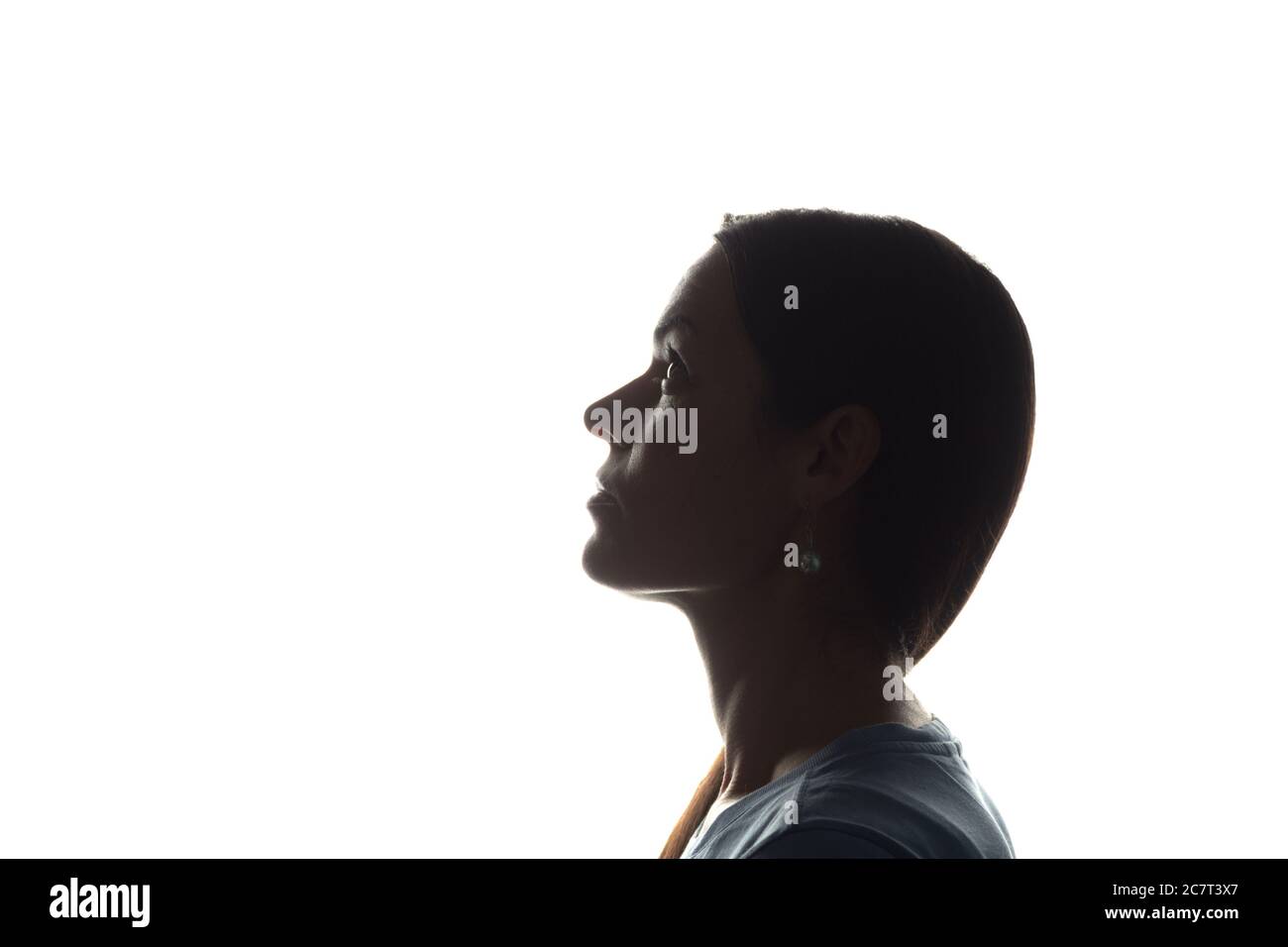 Young woman looking up - horizontal silhouette of a side view Stock ...