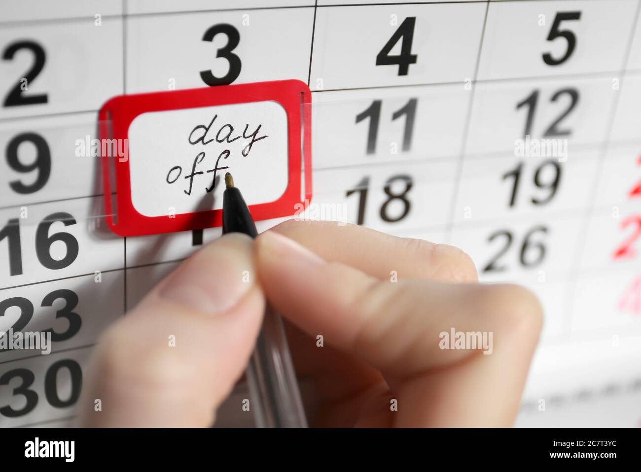Woman marking day-off in calendar, closeup Stock Photo - Alamy