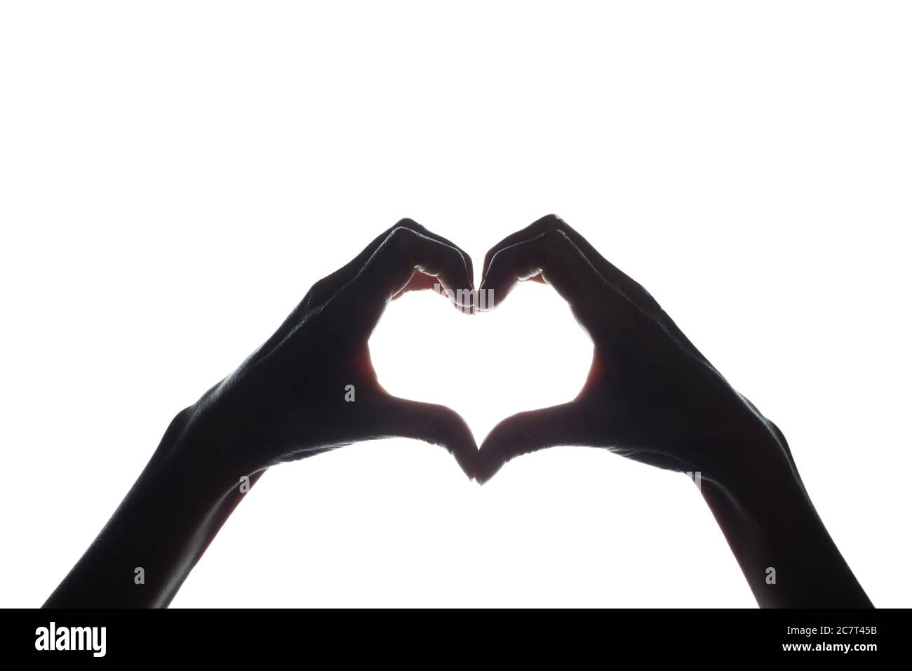 Woman making finger heart gesture Cut Out Stock Images & Pictures - Alamy