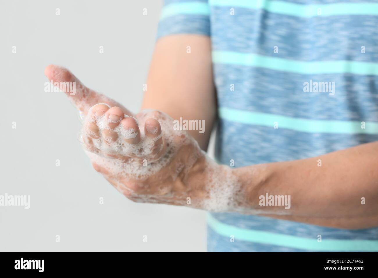 Guy washing his hands hi-res stock photography and images - Alamy