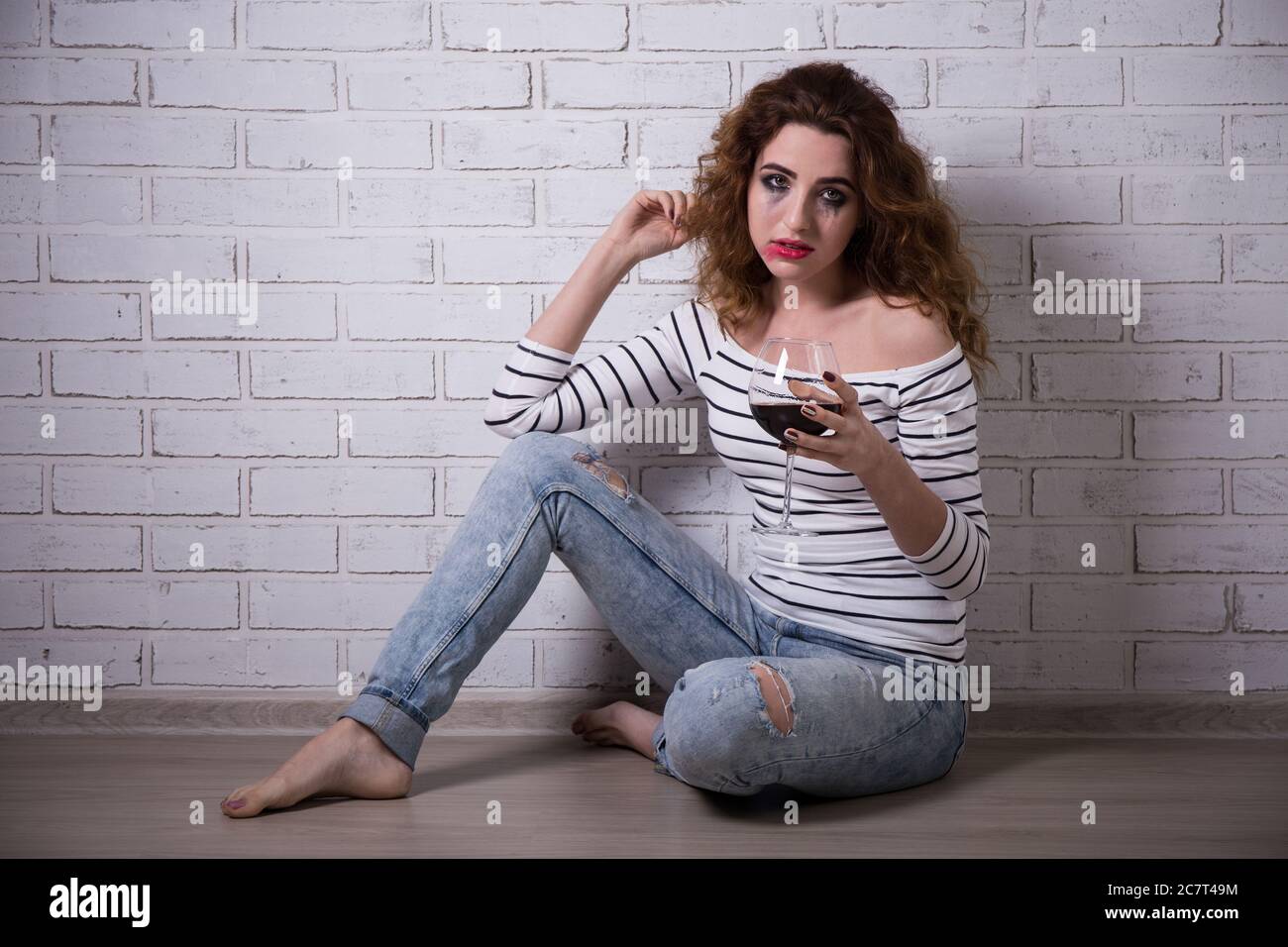 depression and alcoholism - unhappy young woman crying and drinking ...