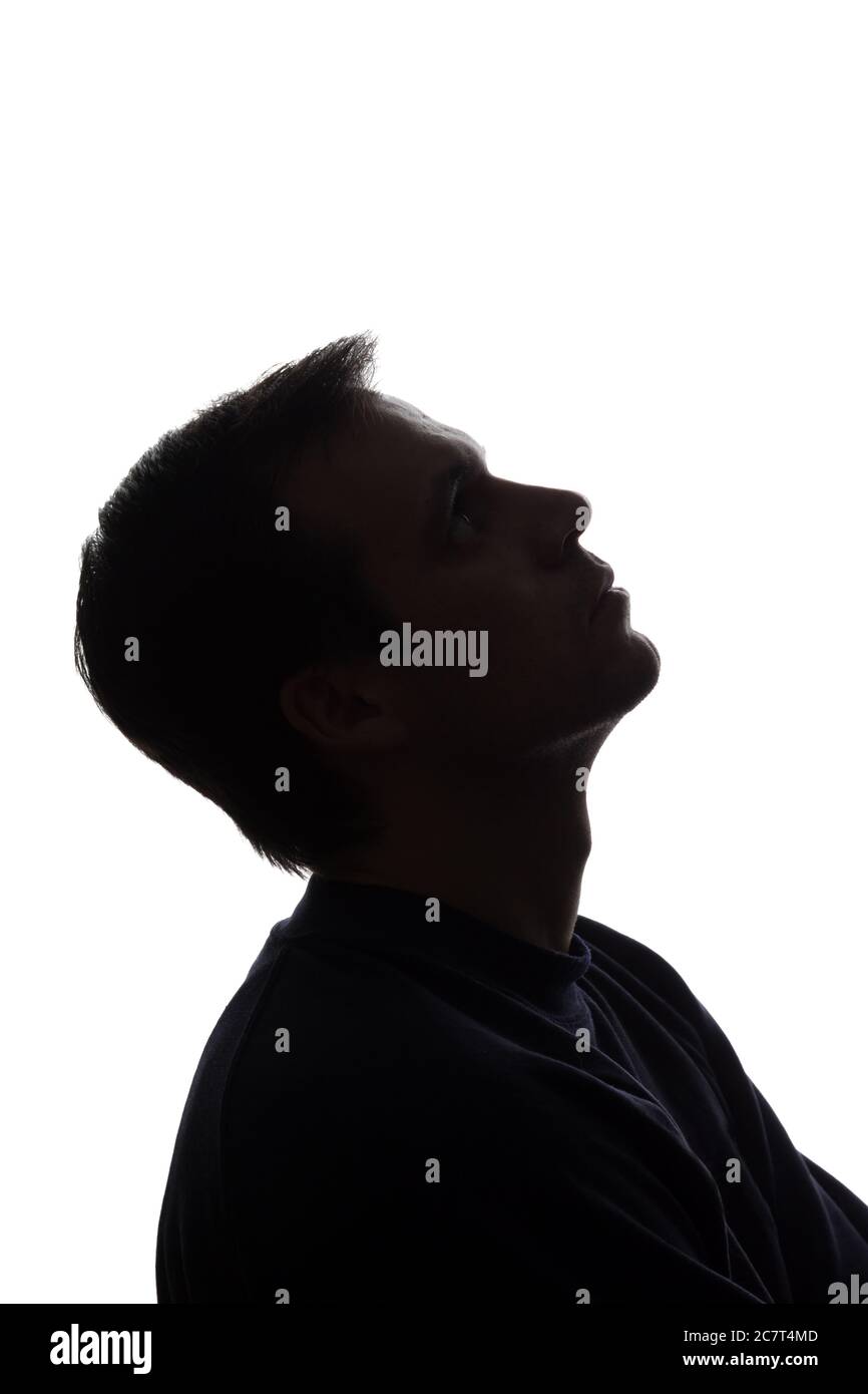 Portrait of a young man, side view - dark silhouette Stock Photo - Alamy