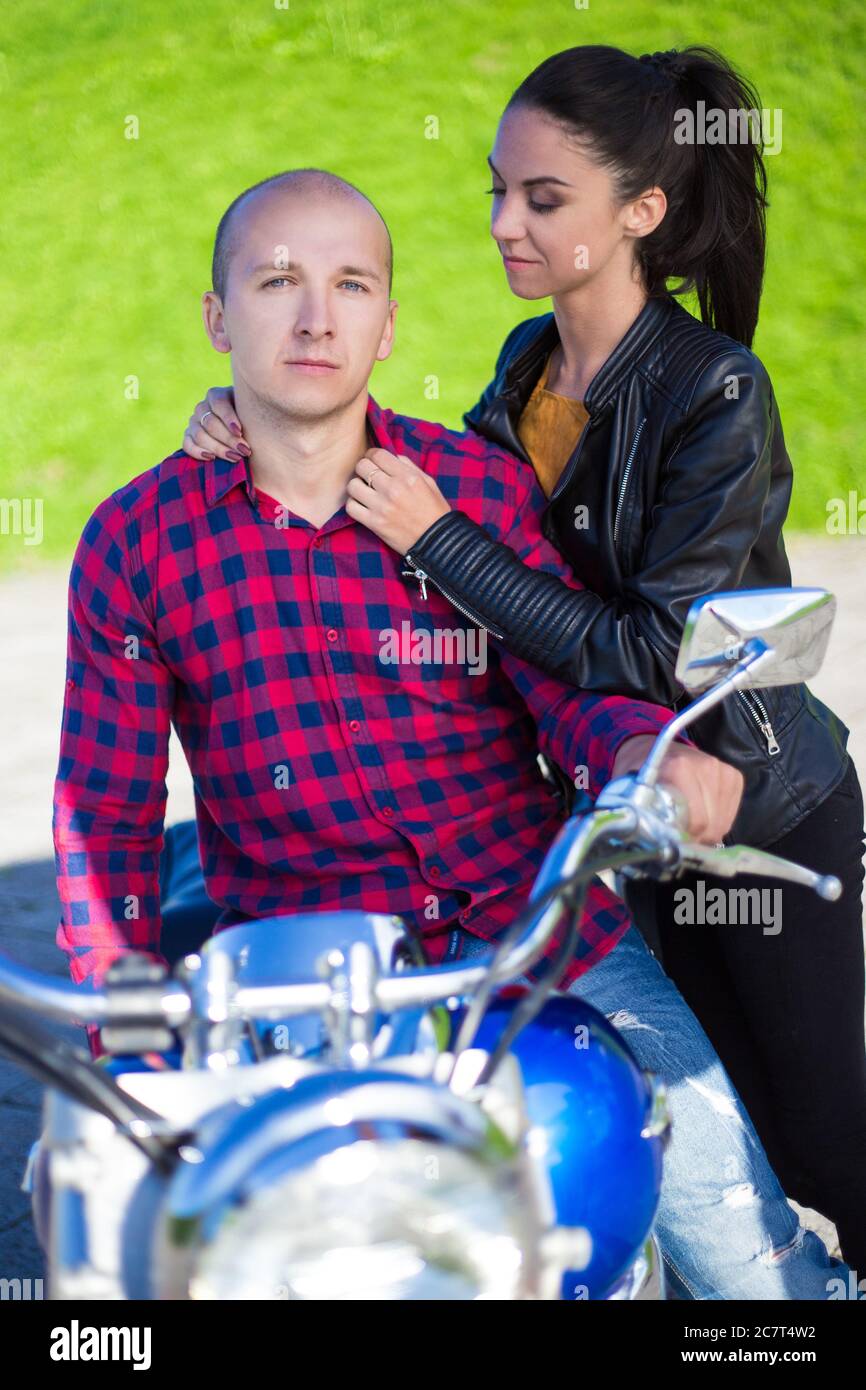 portrait of young couple in love with retro motorcycle Stock Photo - Alamy