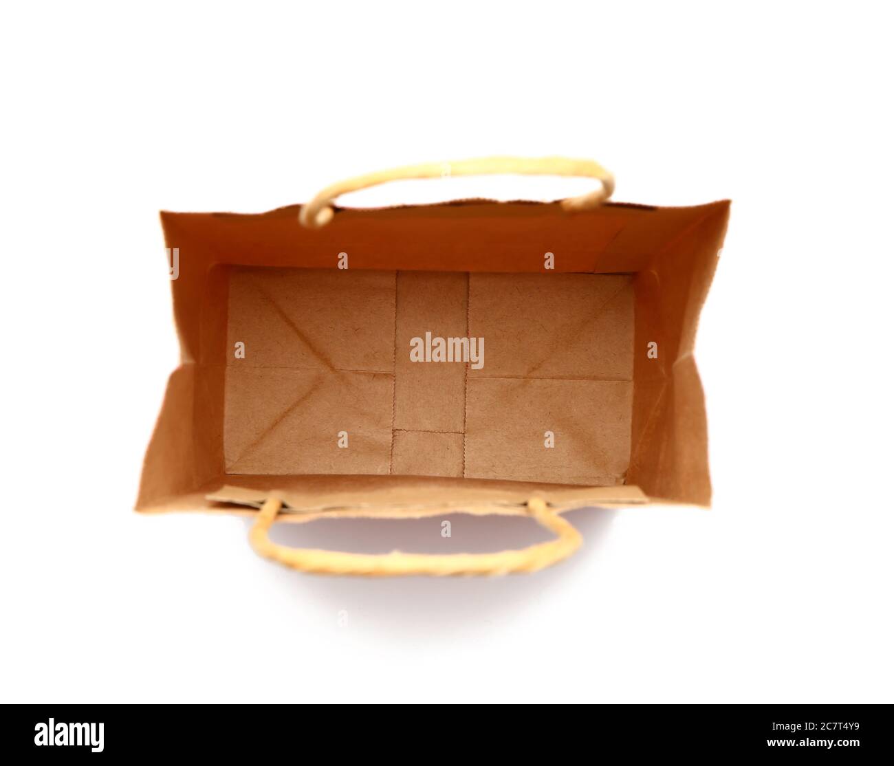 Empty paper shopping bag on white background Stock Photo - Alamy