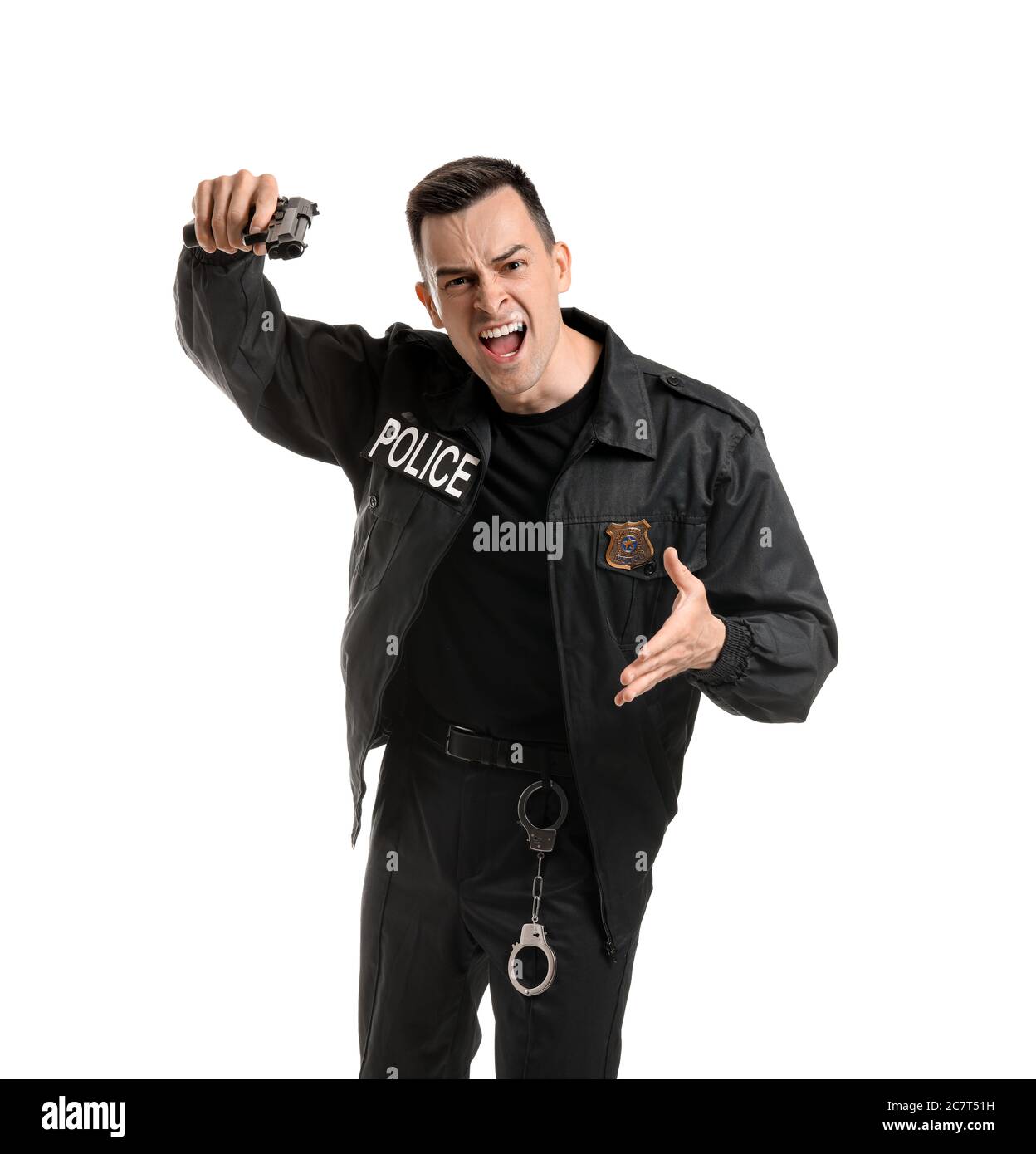 Aggressive police officer with gun on white background Stock Photo - Alamy
