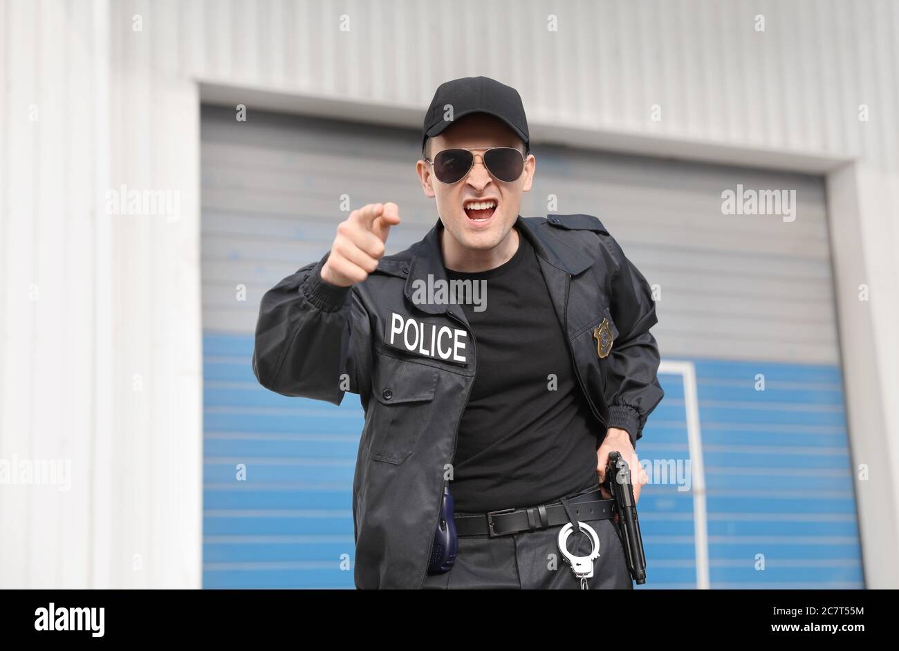 Aggressive police officer in the street Stock Photo - Alamy