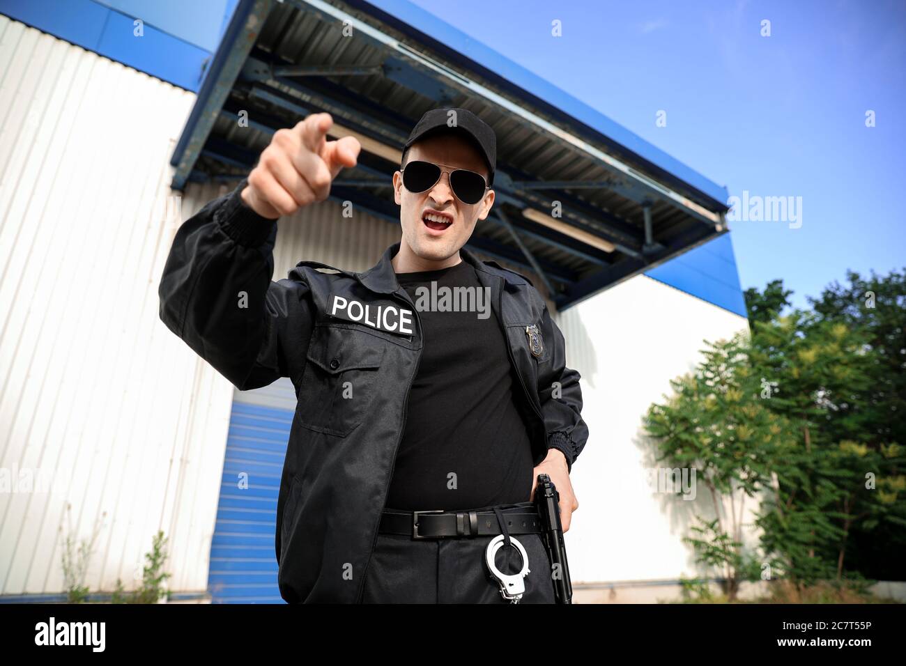 Aggressive police officer in the street Stock Photo - Alamy