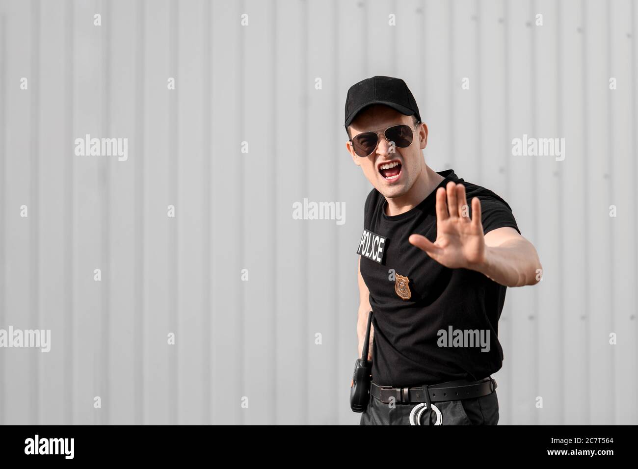 Aggressive police officer in the street Stock Photo - Alamy