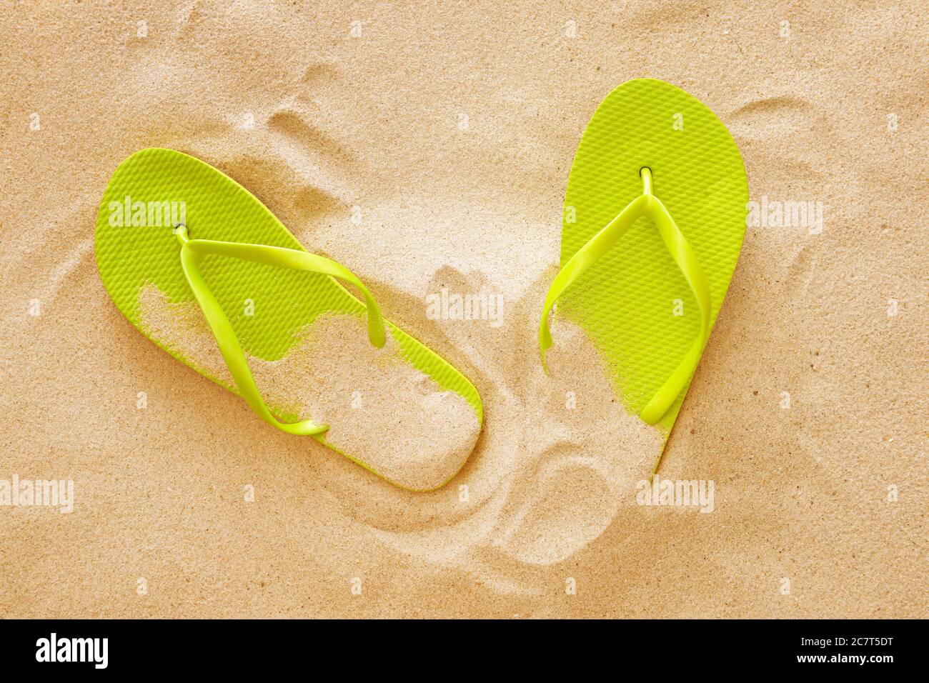 Stylish flip-flops on beach sand Stock Photo - Alamy