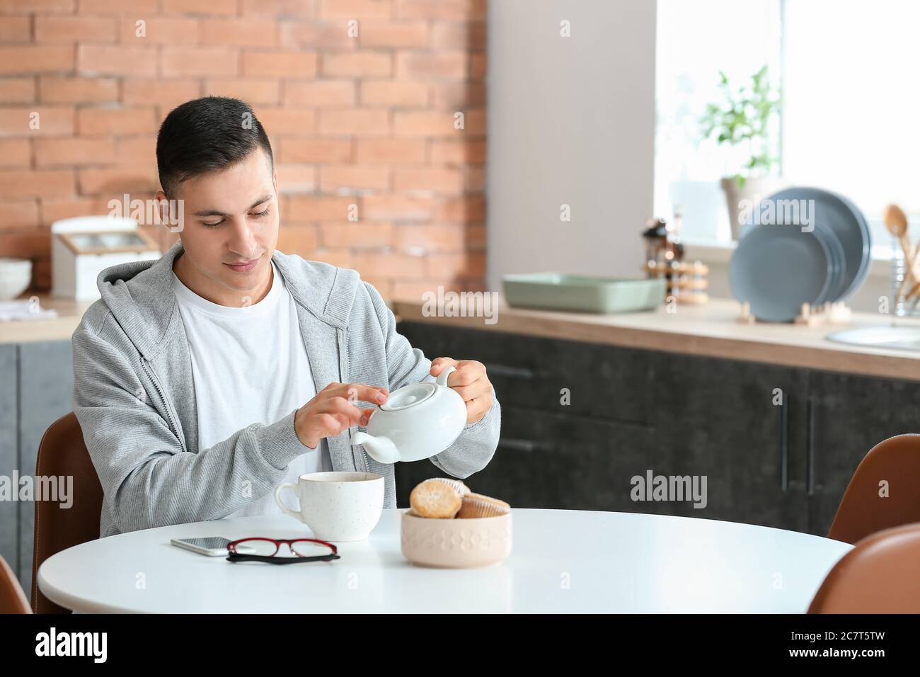 Natural young man pouring drinking hi-res stock photography and images ...