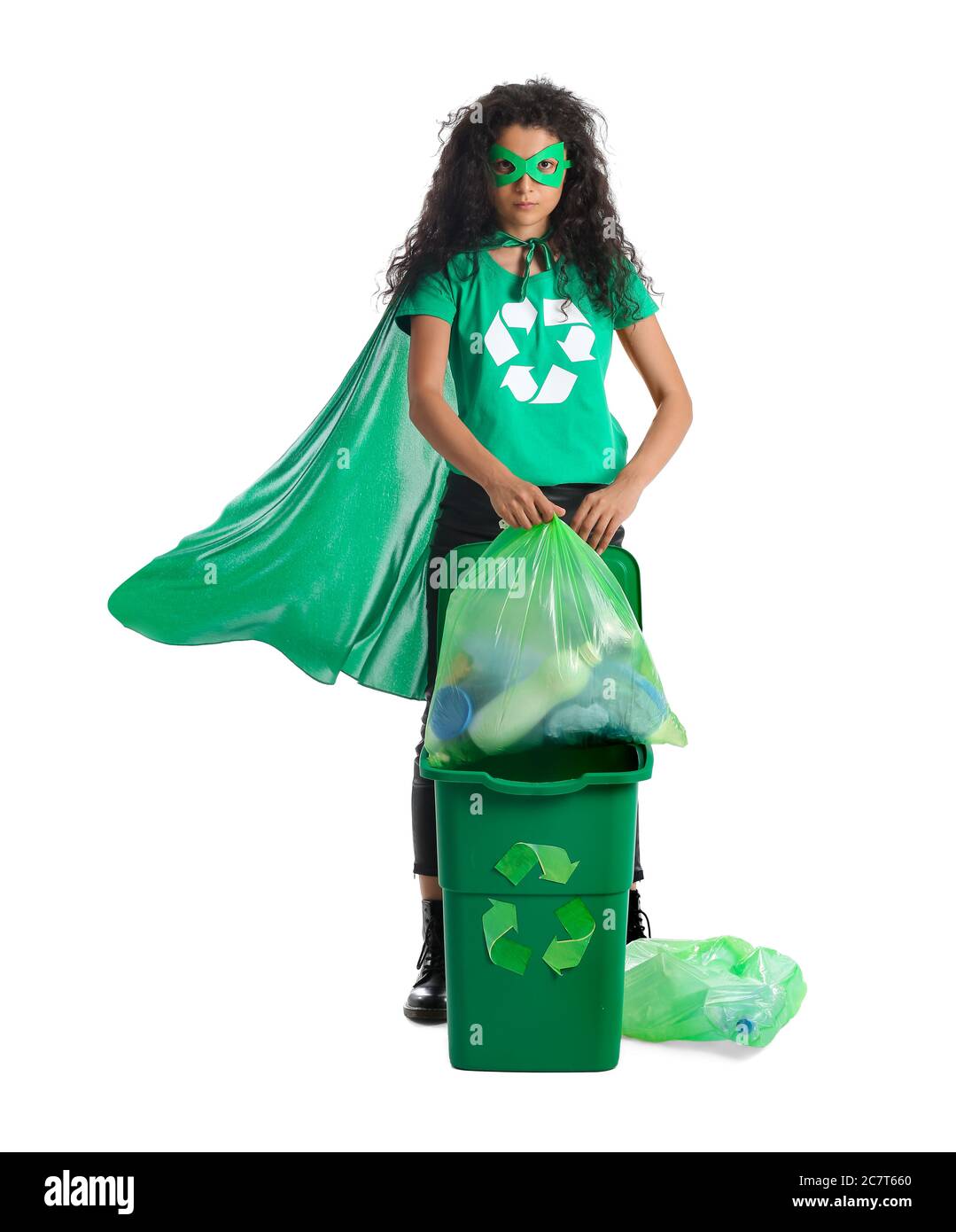 Woman dressed as eco superhero with trash on white background Stock ...