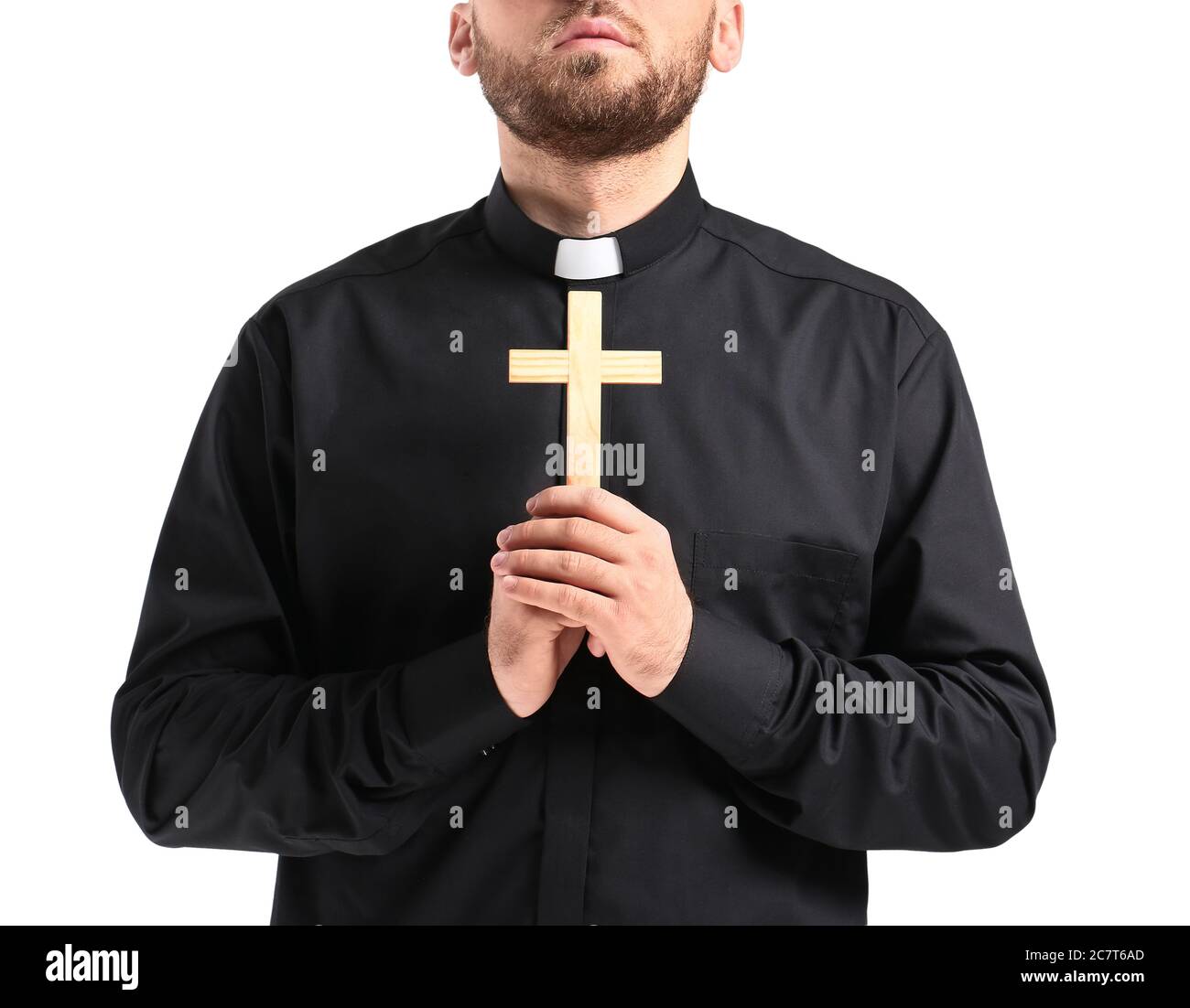 Young priest with cross on white background Stock Photo - Alamy