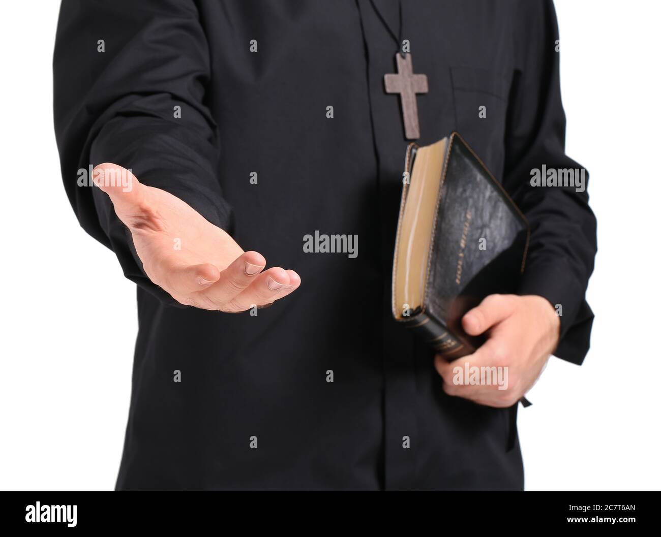 Handsome young priest with Bible on white background, closeup Stock ...