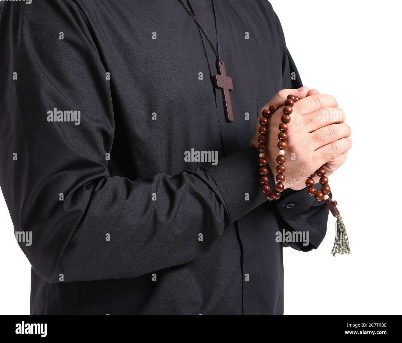 Young catholic priest praying rosary hi-res stock photography and ...