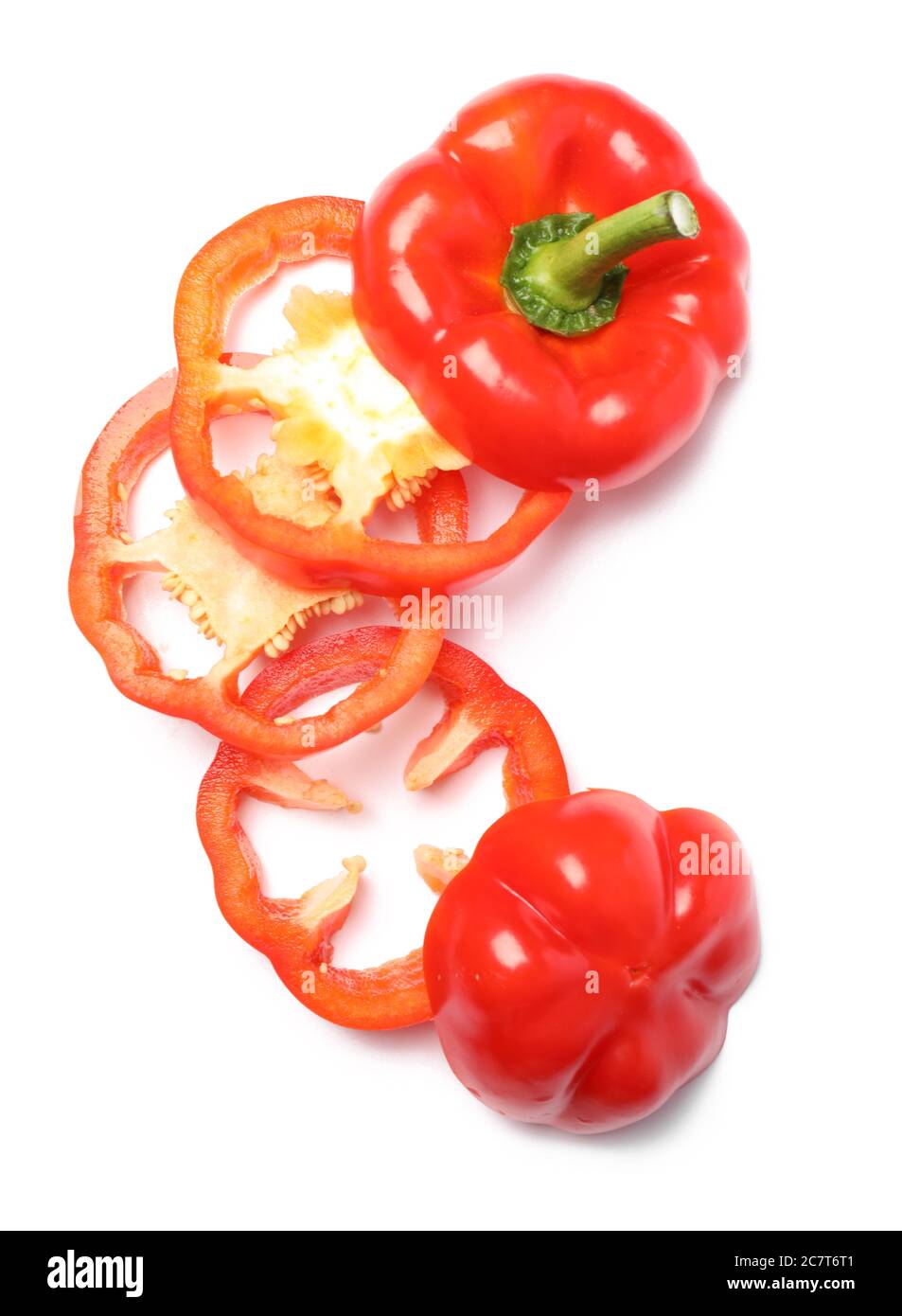 Cut red bell pepper on white background Stock Photo - Alamy