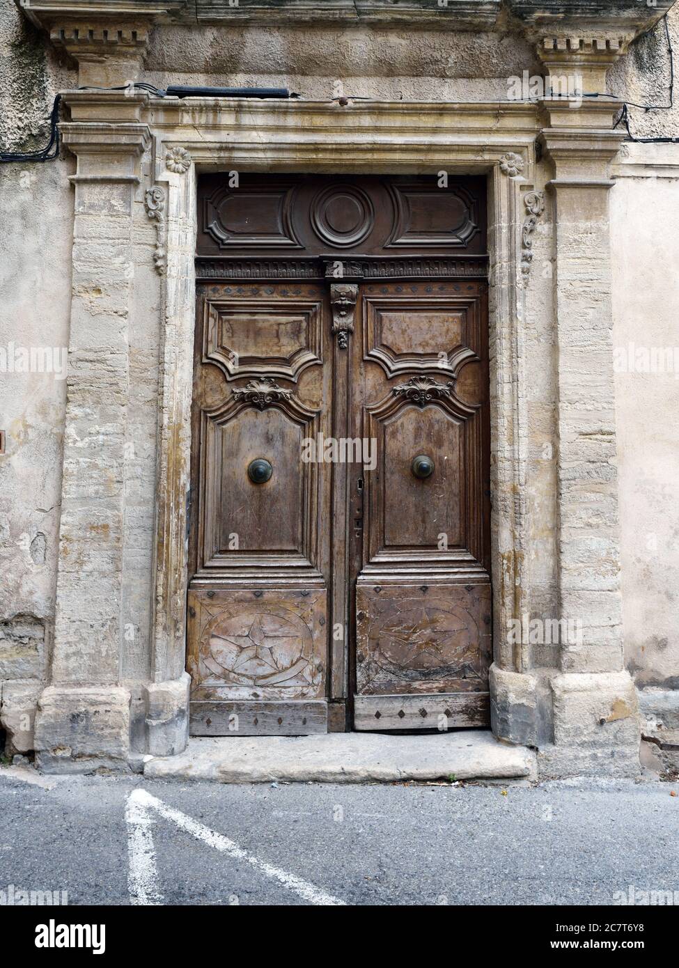 Renaissance wooden door in Mazan village, Provence, France Stock Photo ...