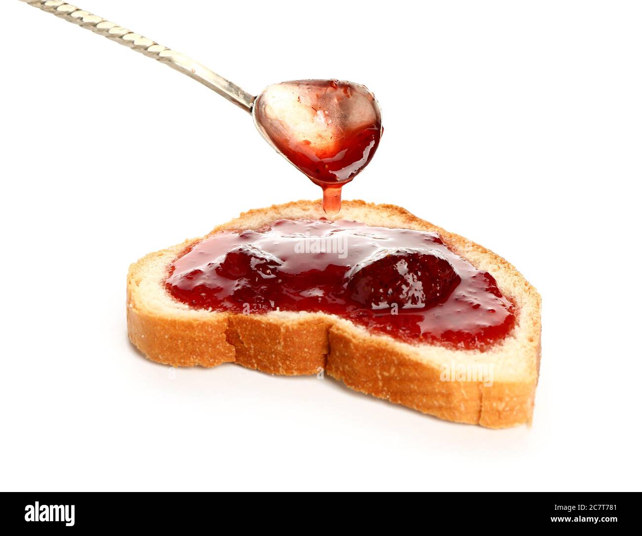 Bread and spoon with tasty strawberry jam on white background Stock ...