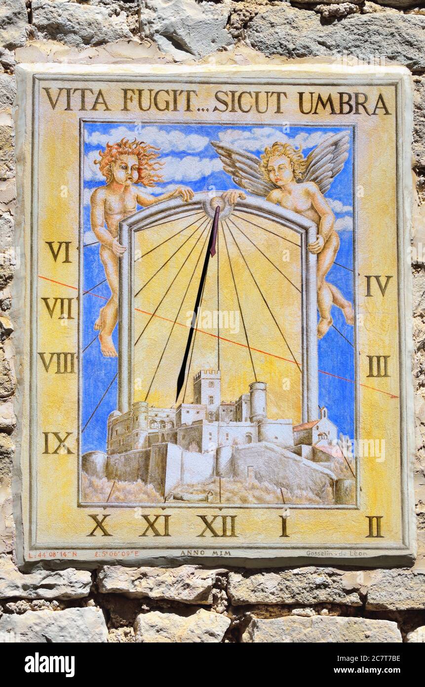 Ancient sundial clock on the stone wall of castle Le Barroux, Provence ...