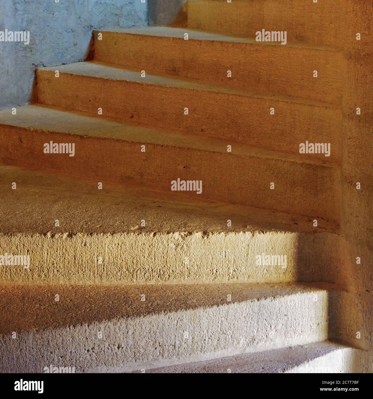 Stone steps of the medieval spiral staircase in old castle. France ...