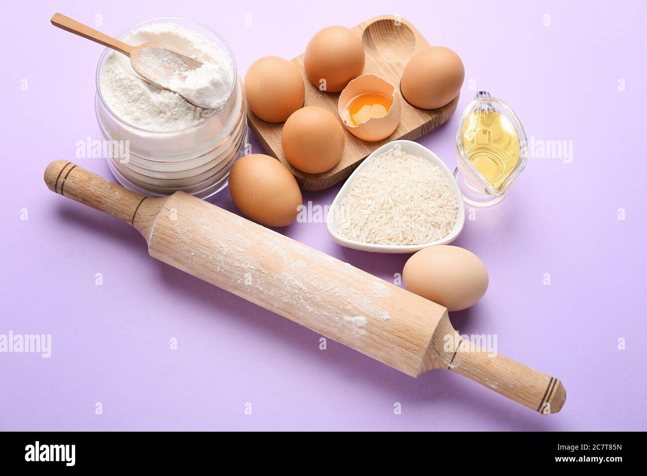 Rice flour with products on color background Stock Photo - Alamy