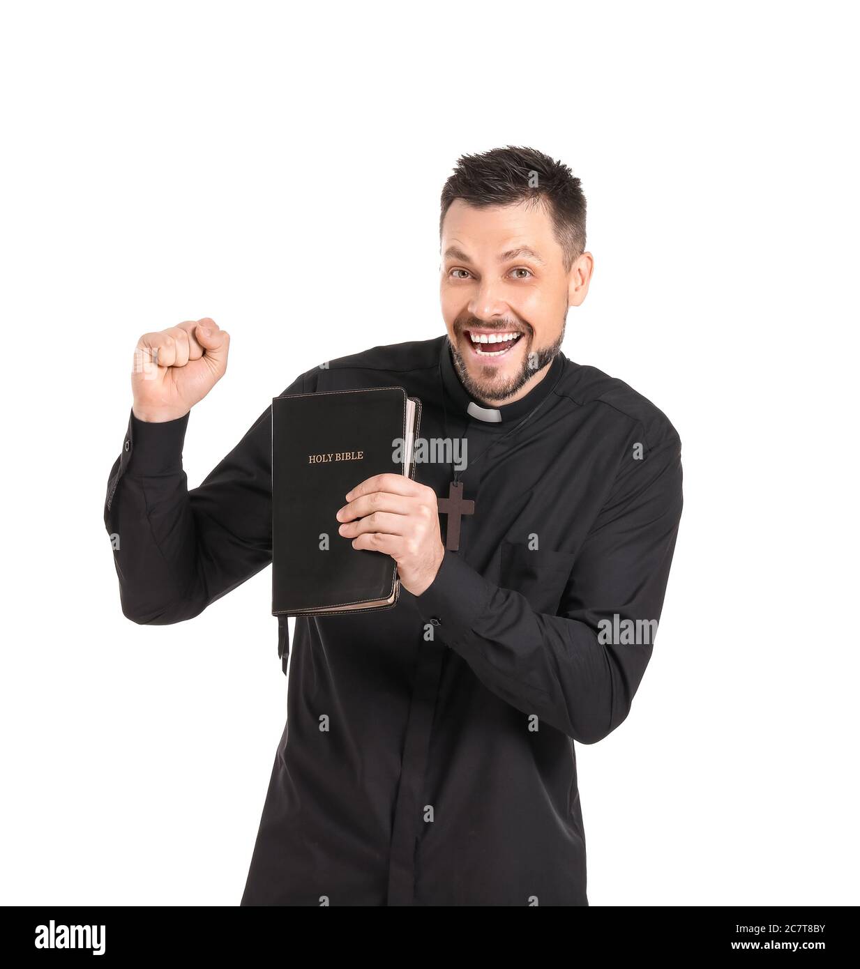 Happy priest with Bible on white background Stock Photo - Alamy
