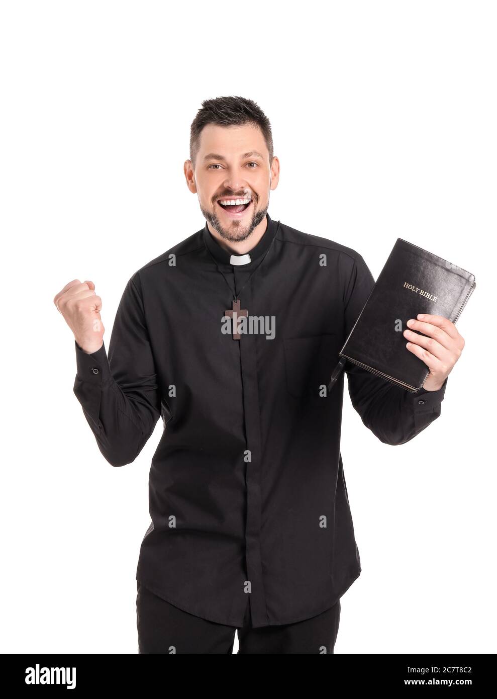 Happy priest with Bible on white background Stock Photo - Alamy