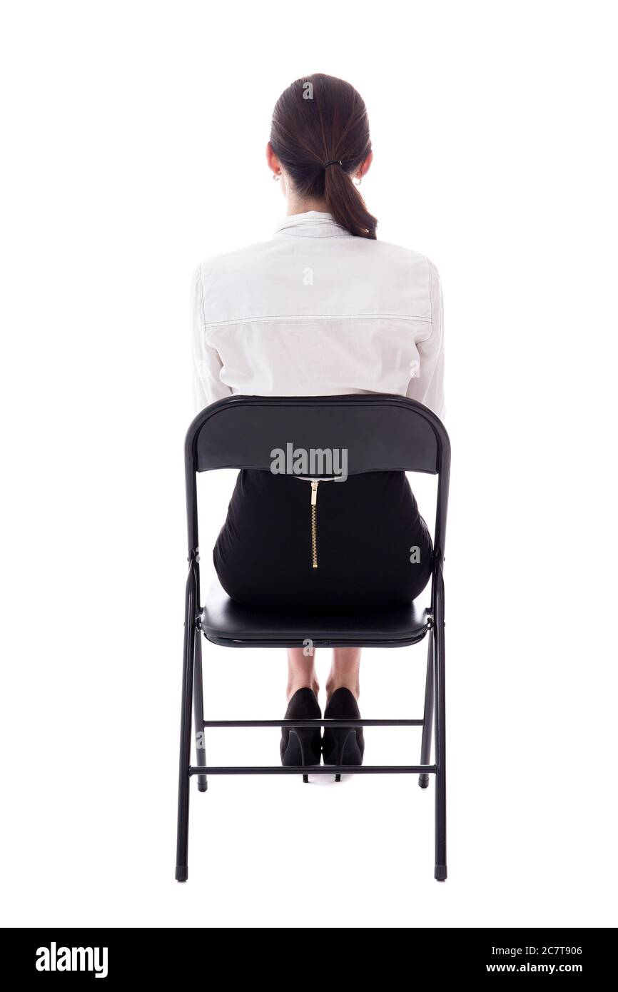 back view of young woman sitting on office chair isolated on white ...