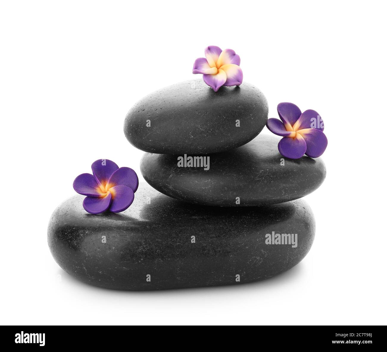 Spa stones and flowers on white background Stock Photo - Alamy