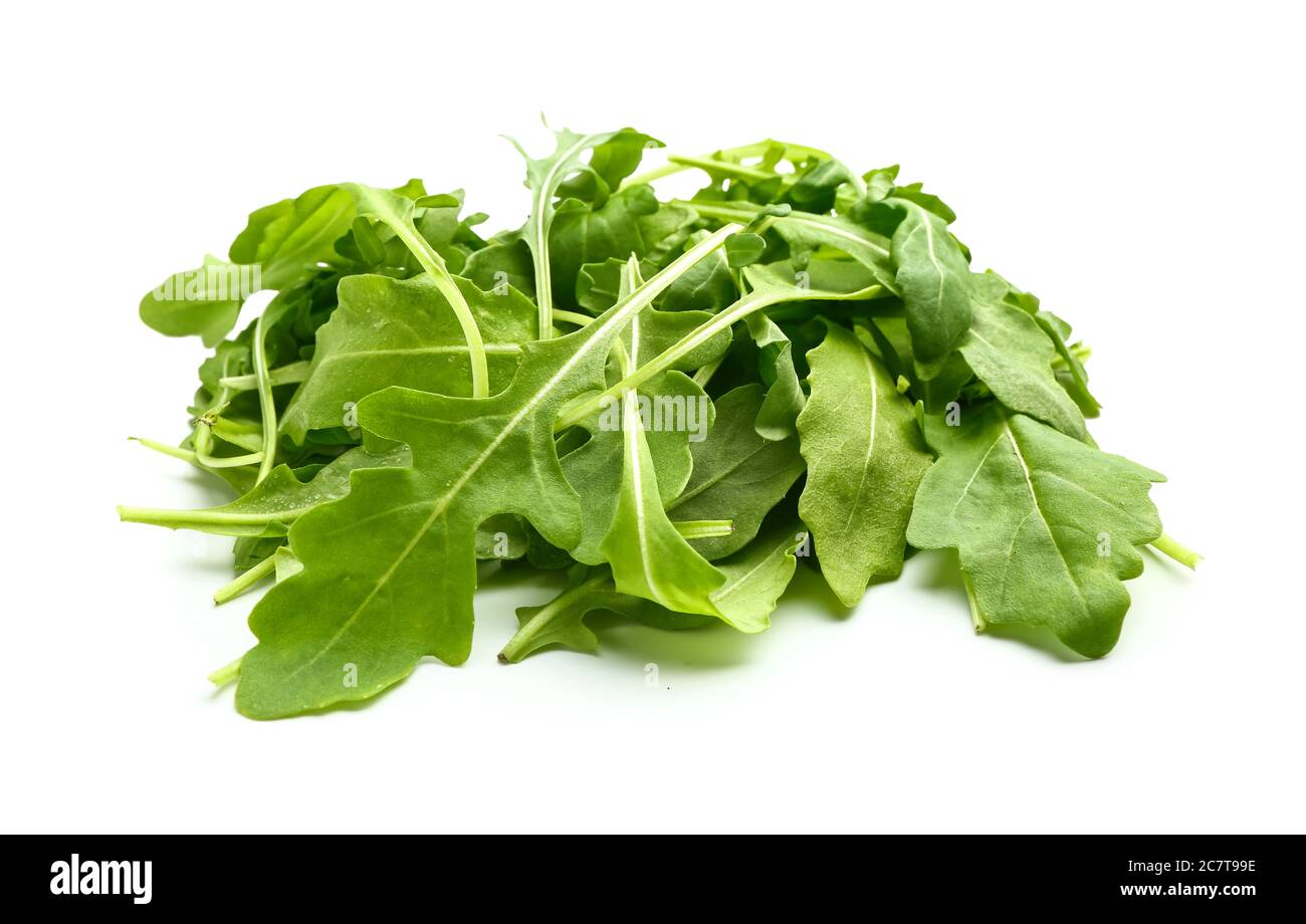 Fresh arugula on white background Stock Photo - Alamy