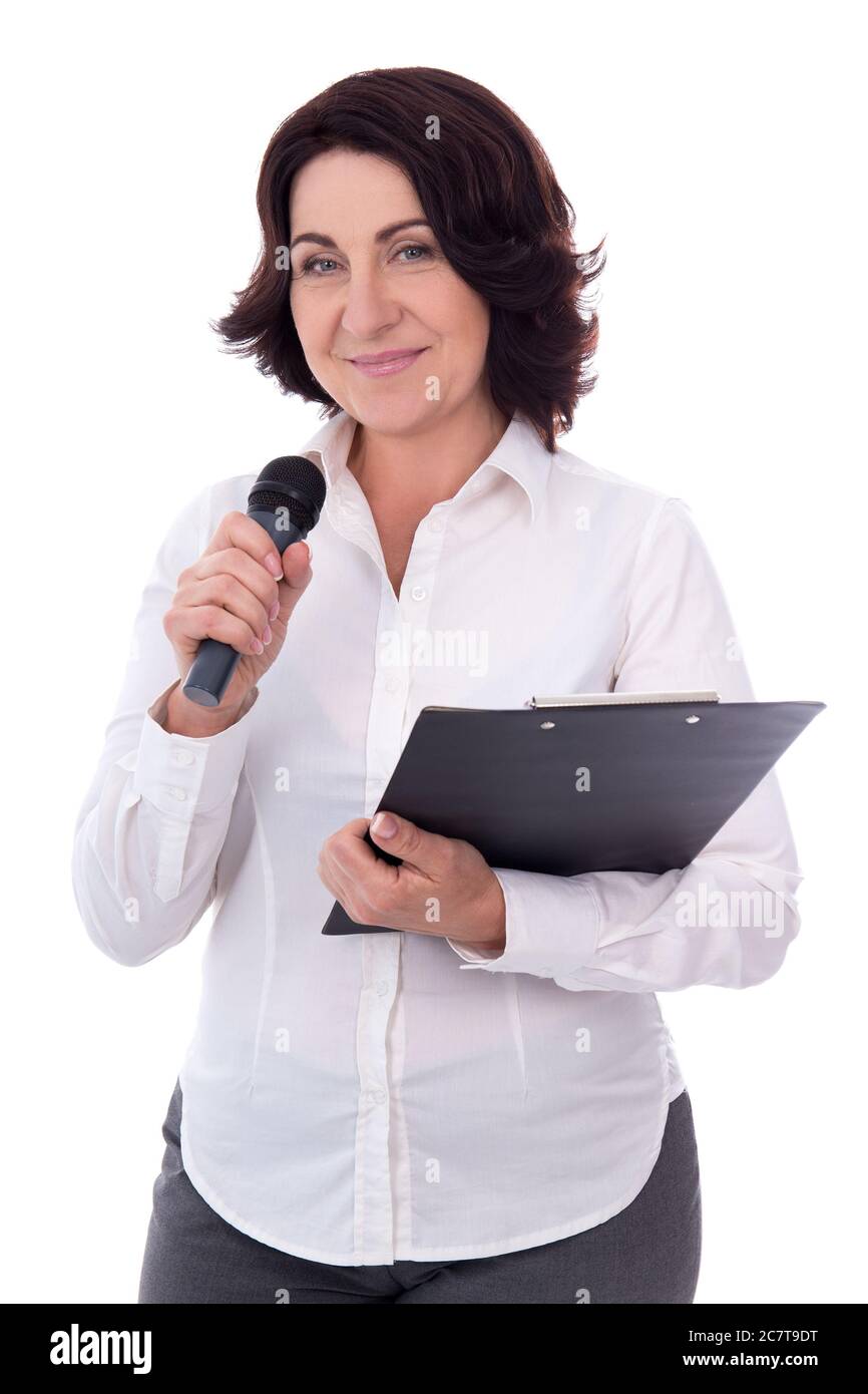 portrait of mature female reporter with microphone and clipboard ...