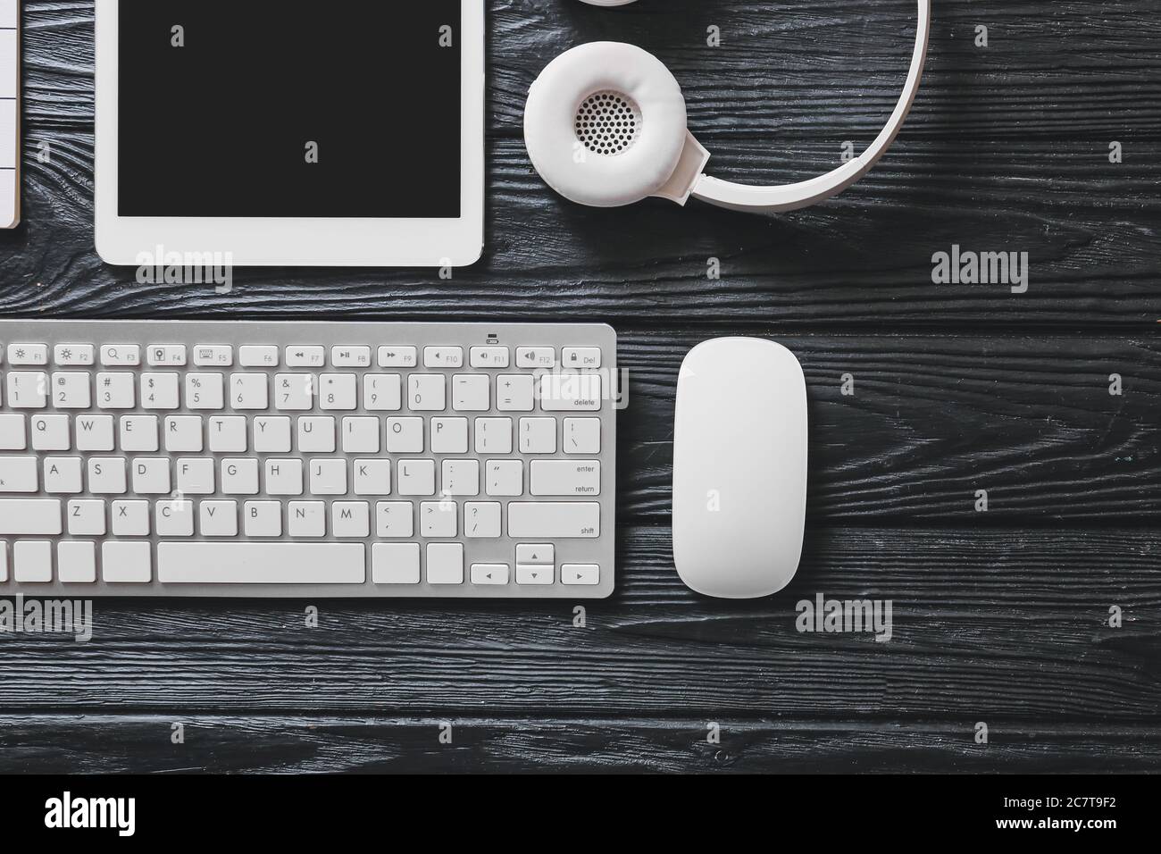 PC keyboard, tablet, mouse and headphones on table Stock Photo - Alamy