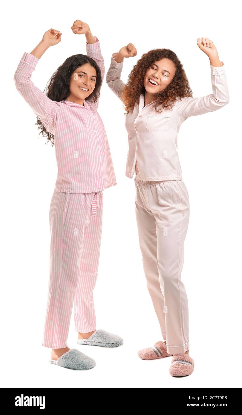 Beautiful young women in pajamas on white background Stock Photo - Alamy