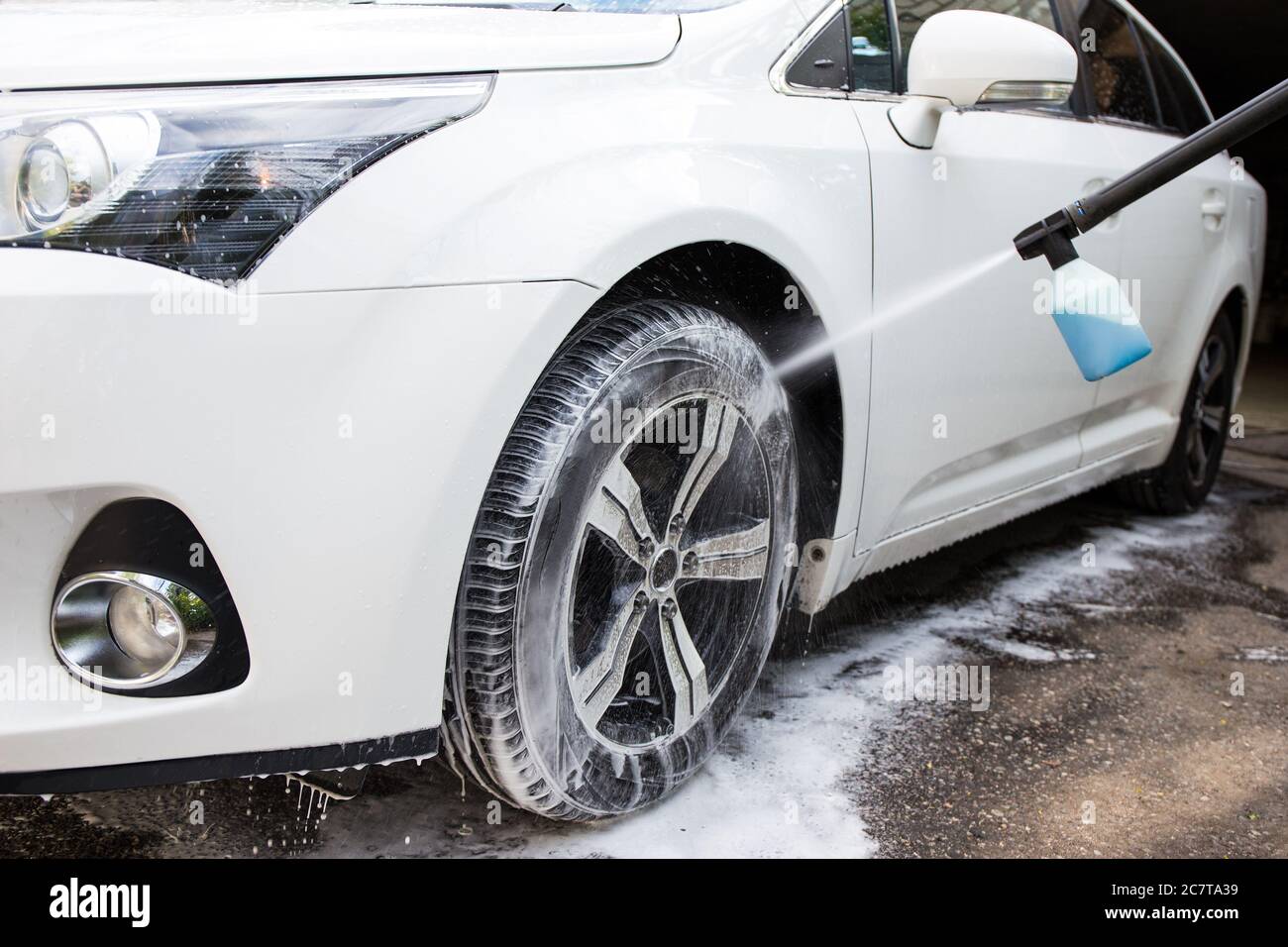 washing car wheel with high pressure water and chemicals Stock Photo ...
