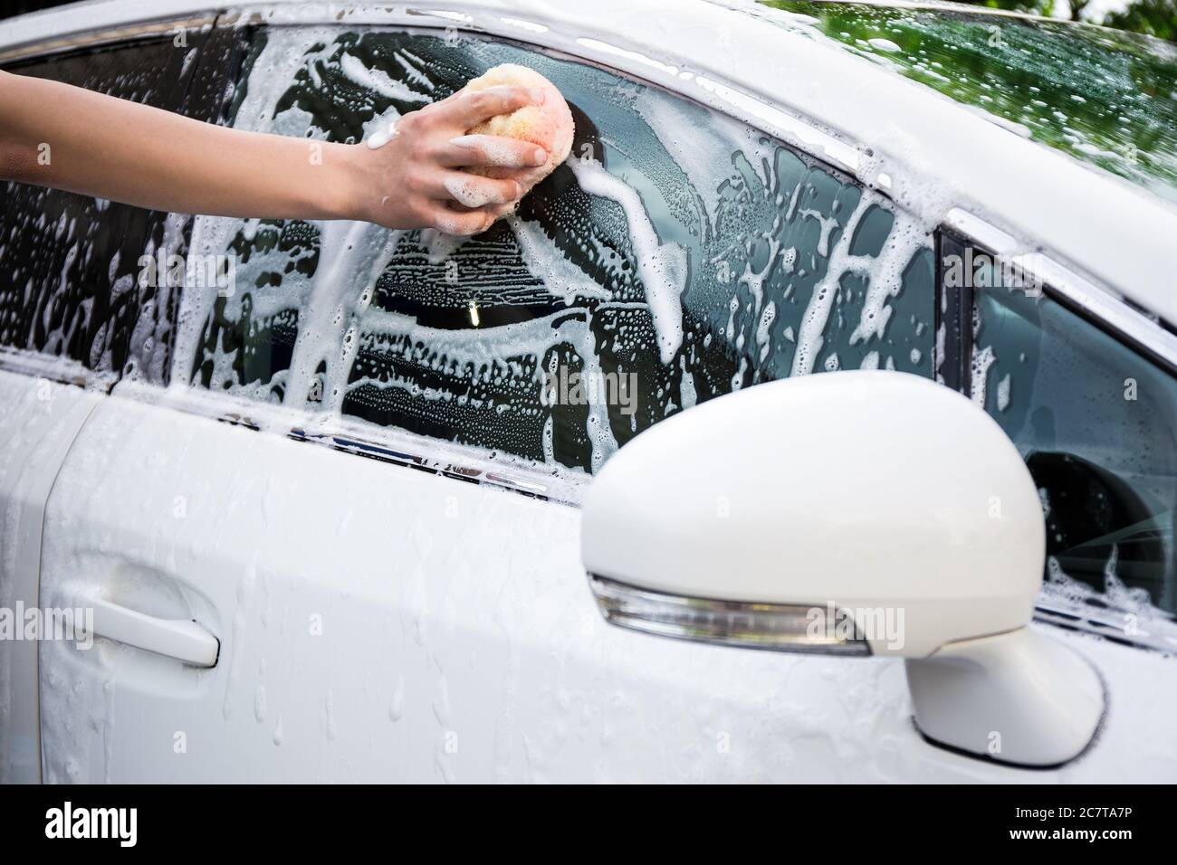 male hand washing white car with sponge Stock Photo - Alamy