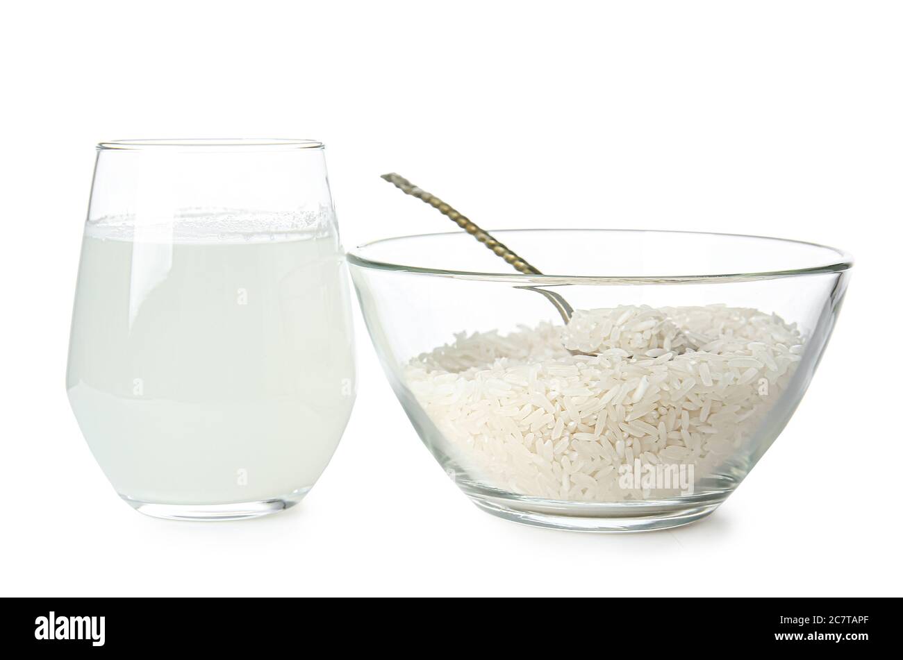 Glass of rice water on white background Stock Photo - Alamy