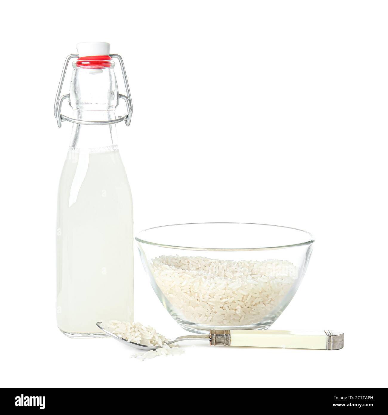 Bottle of rice water on white background Stock Photo - Alamy
