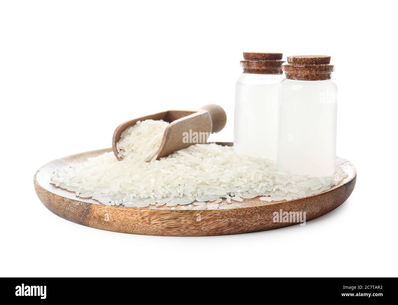 Bottles of rice water on white background Stock Photo - Alamy