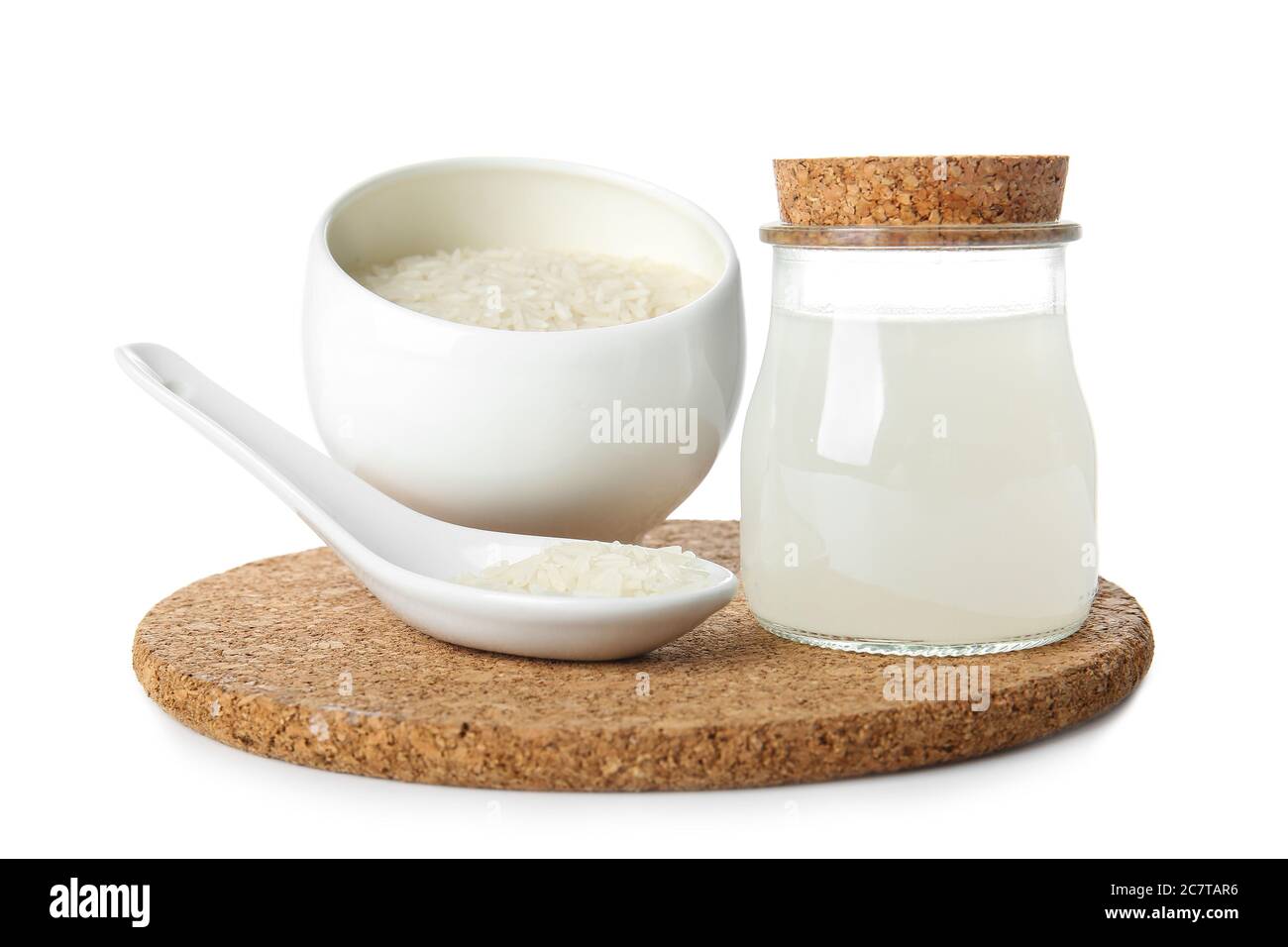 Jar of rice water on white background Stock Photo - Alamy