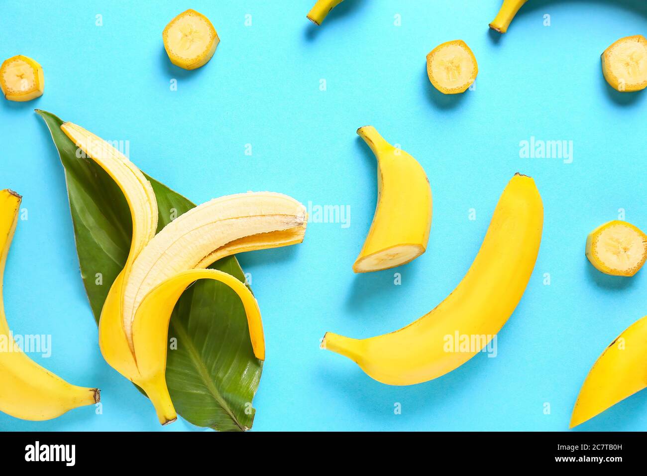 Ripe bananas on color background Stock Photo - Alamy